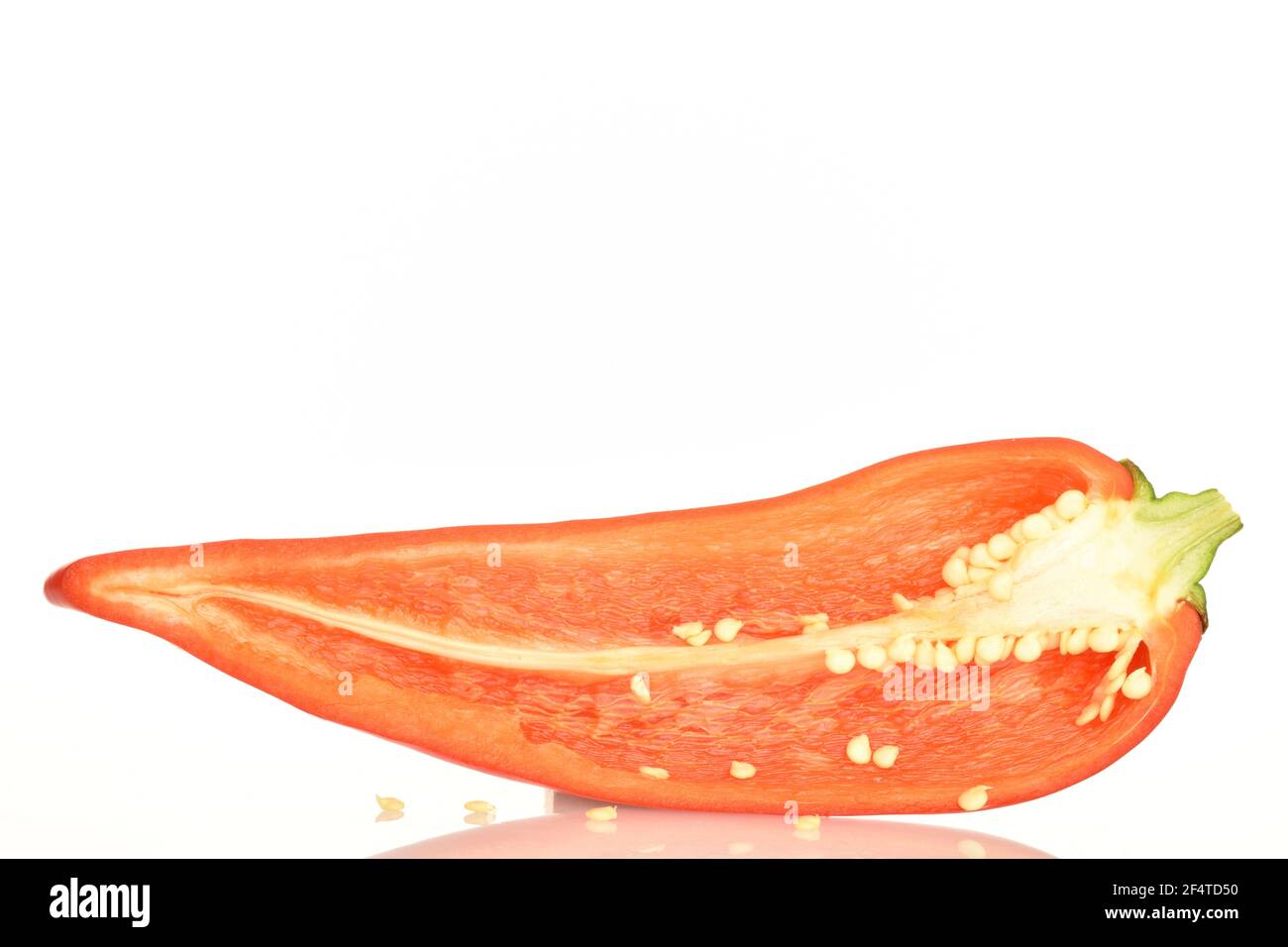 One half of fresh ripe tasty sweet red Kapia pepper on a white ...