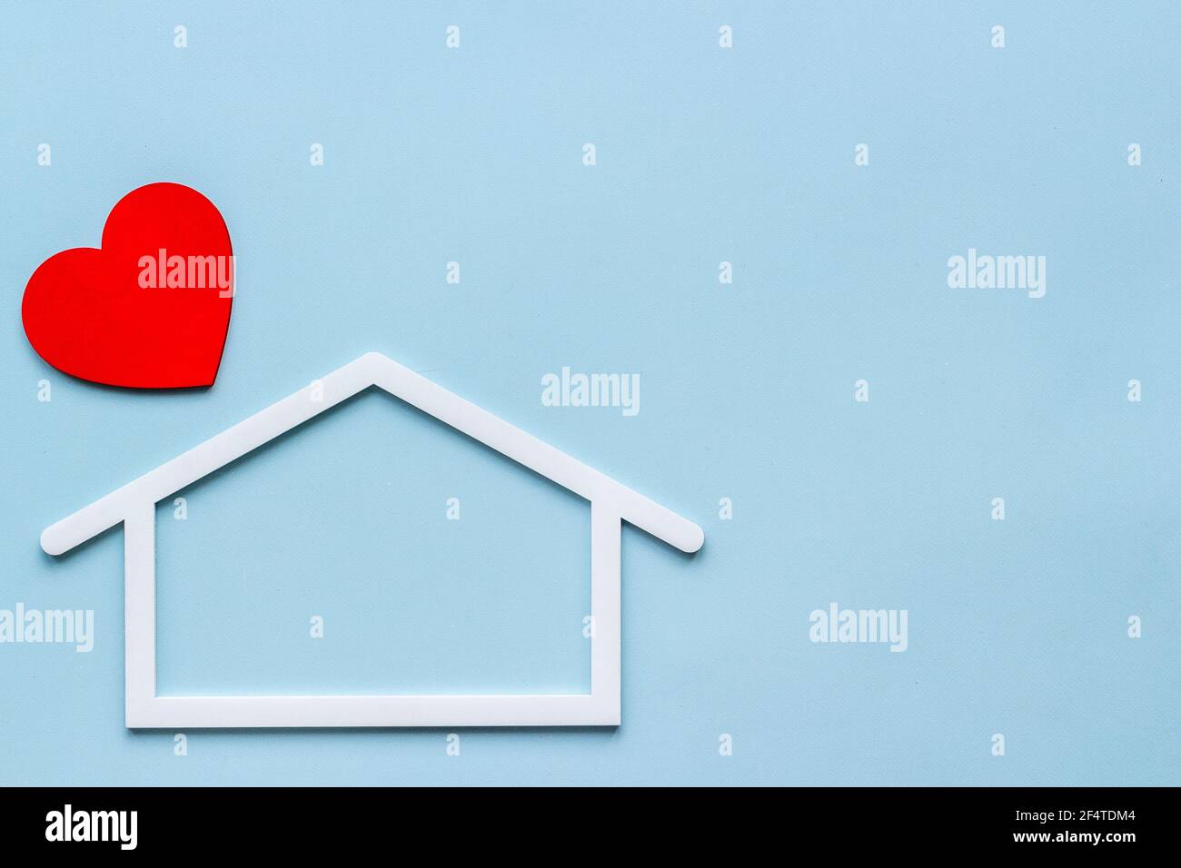 House shape with heart. Love family concept Stock Photo - Alamy