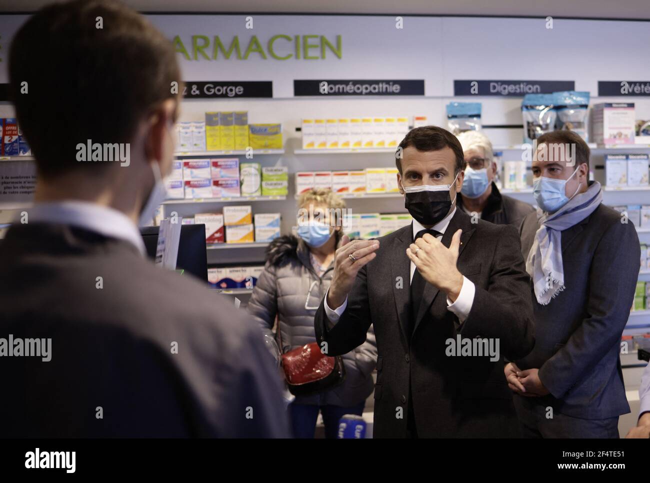 French president Emmanuel Macron attends a visit at a pharmacy who ...