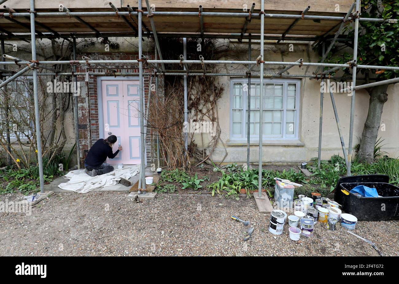 Painter John Parnell paints the front door of Charleston, near Lewes in ...
