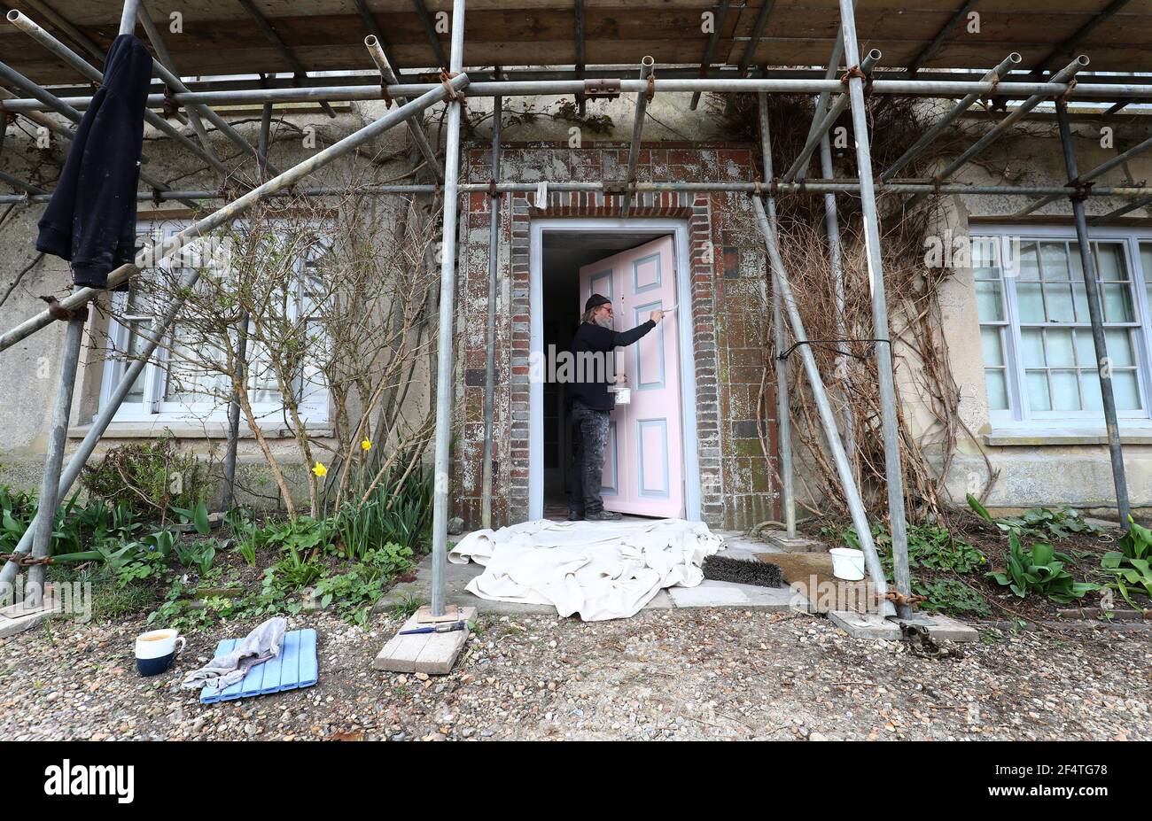 Painter John Parnell paints the front door of Charleston, near Lewes in ...