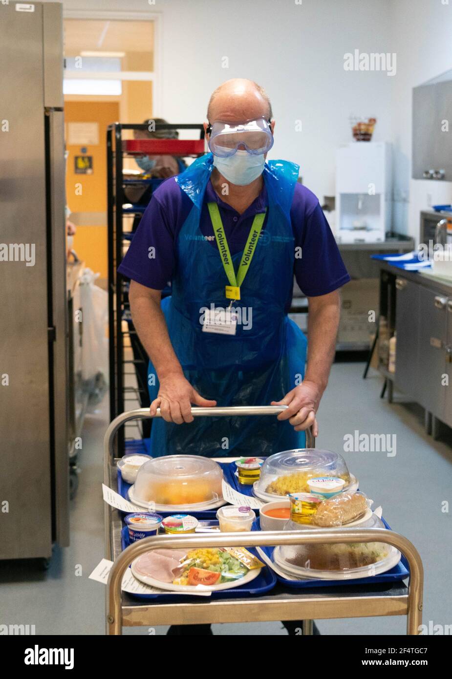 An Imperial Charity volunteer, Michael Amiss, pushing a meal delivery ...