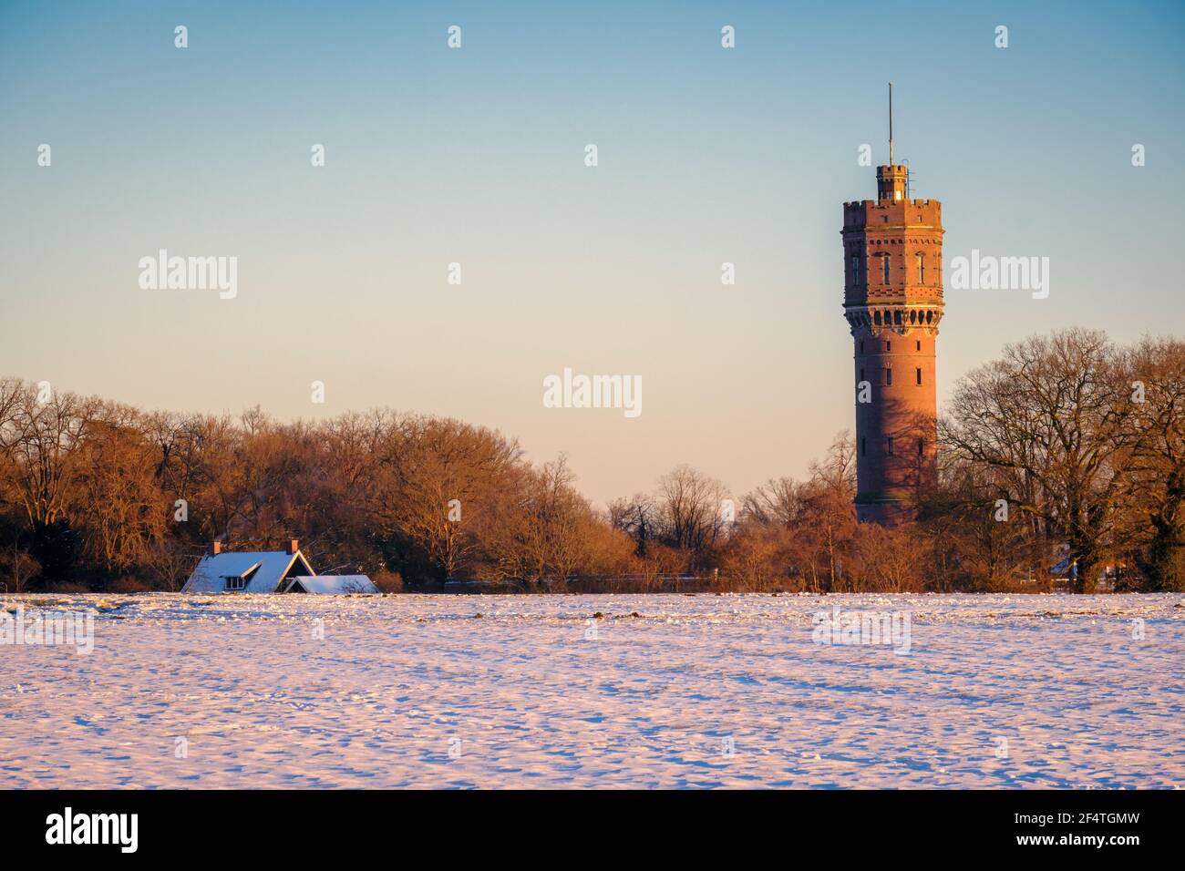 Dutch winter landscape with the water tower of Delden, in the eastern ...