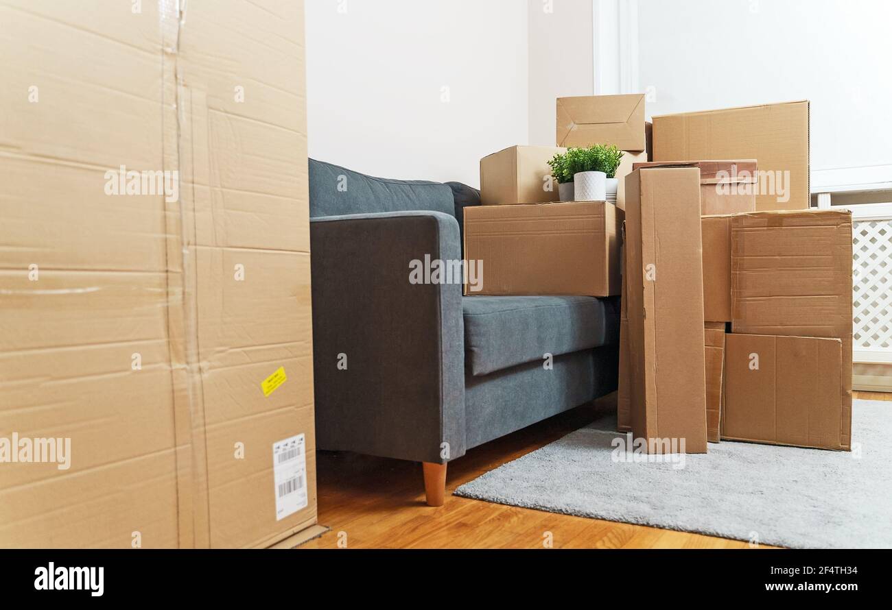 Cardboard boxes in room. Real estate and moving concept Stock Photo - Alamy