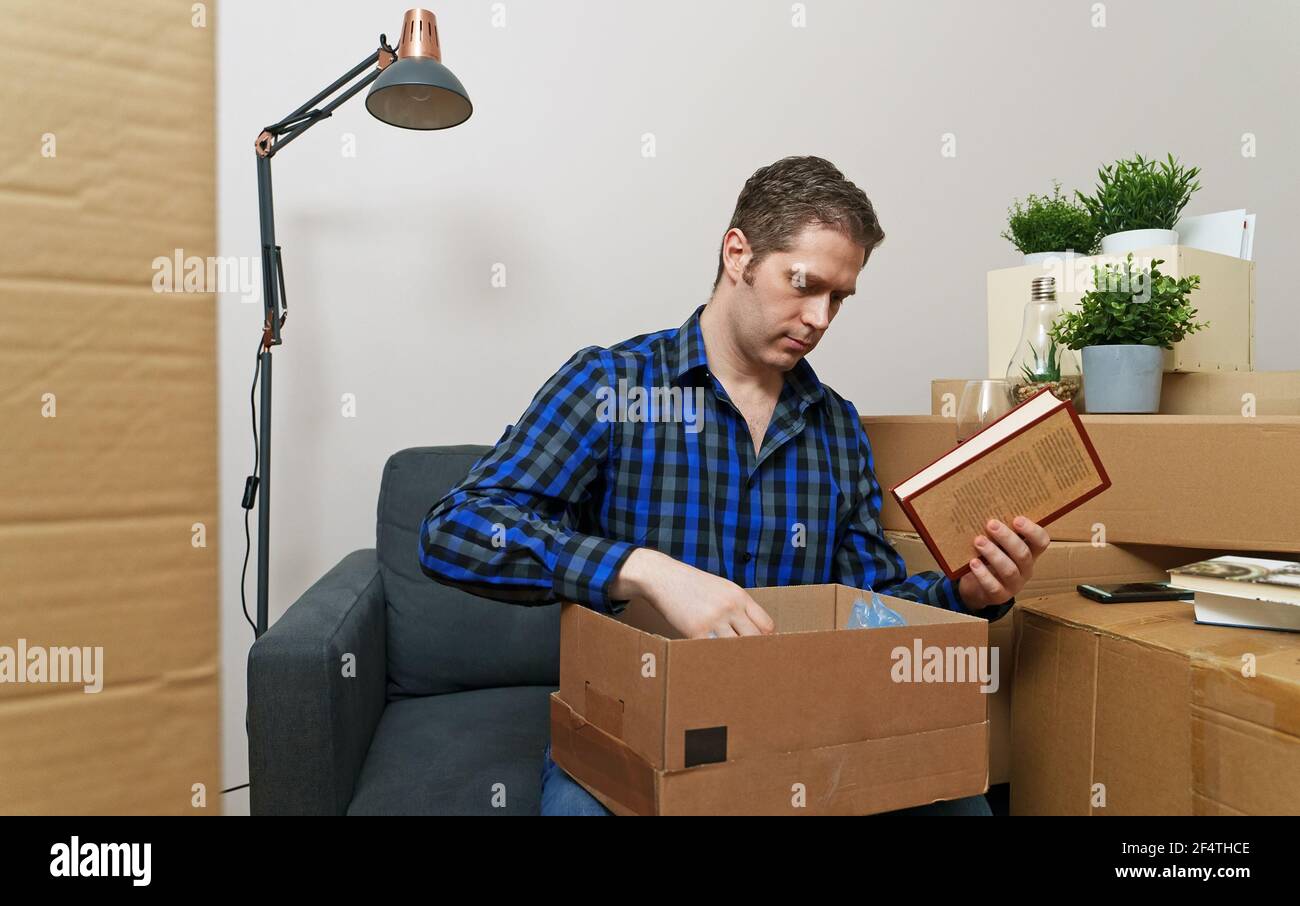 Person Unpacking Unpacking Box Hi Res Stock Photography And Images