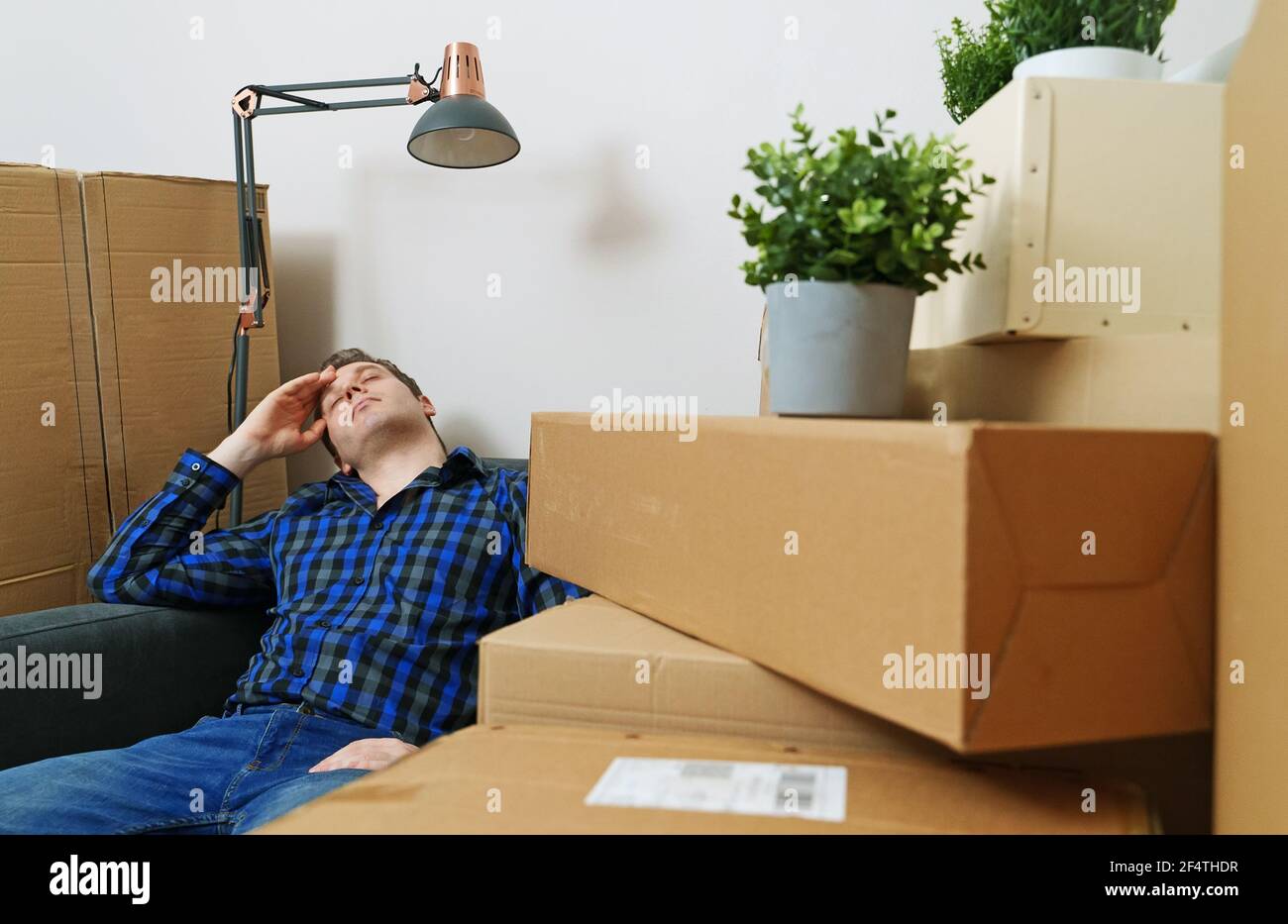 Tired delivery man box hi-res stock photography and images - Alamy