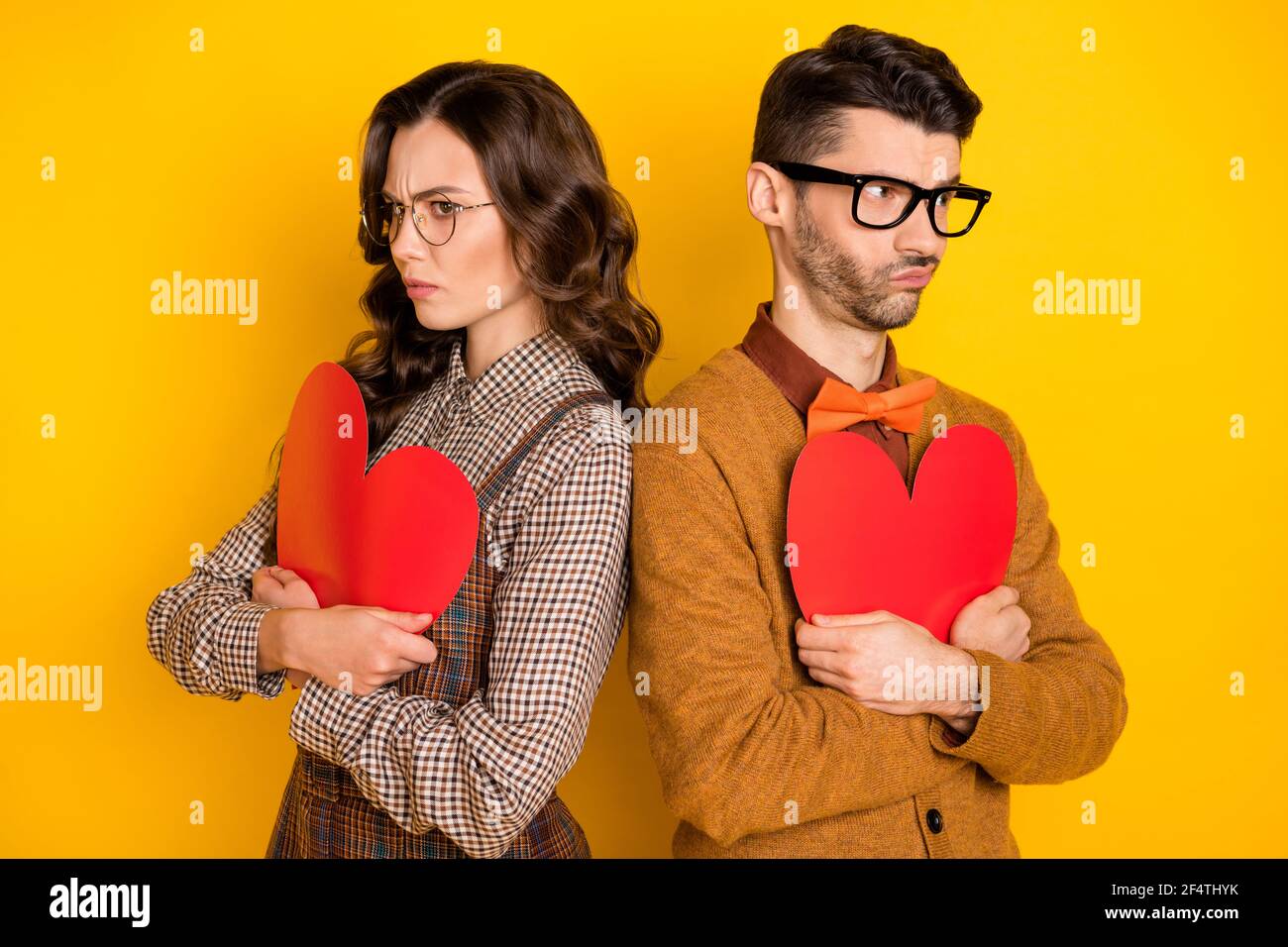 Portrait of moody gloomy offended friends friendship couple embracing ...
