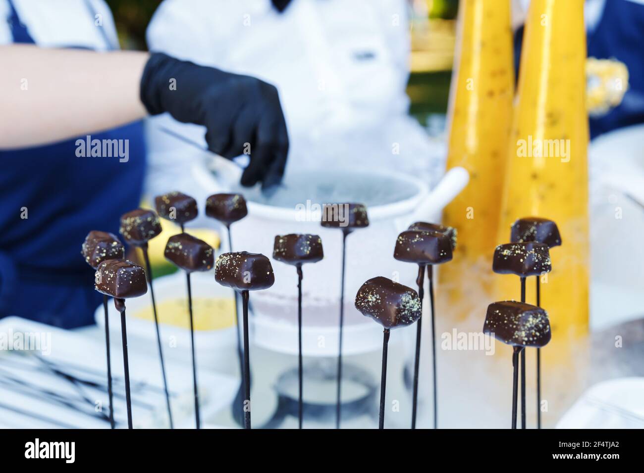 A man makes chocolates outdoors Stock Photo - Alamy