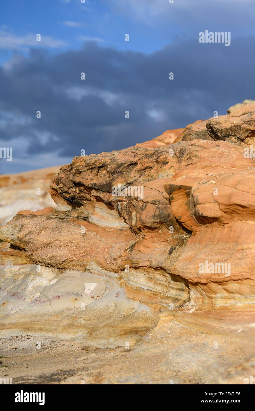 Erosion on the rock near the sea with multiple colors in the cut Stock ...