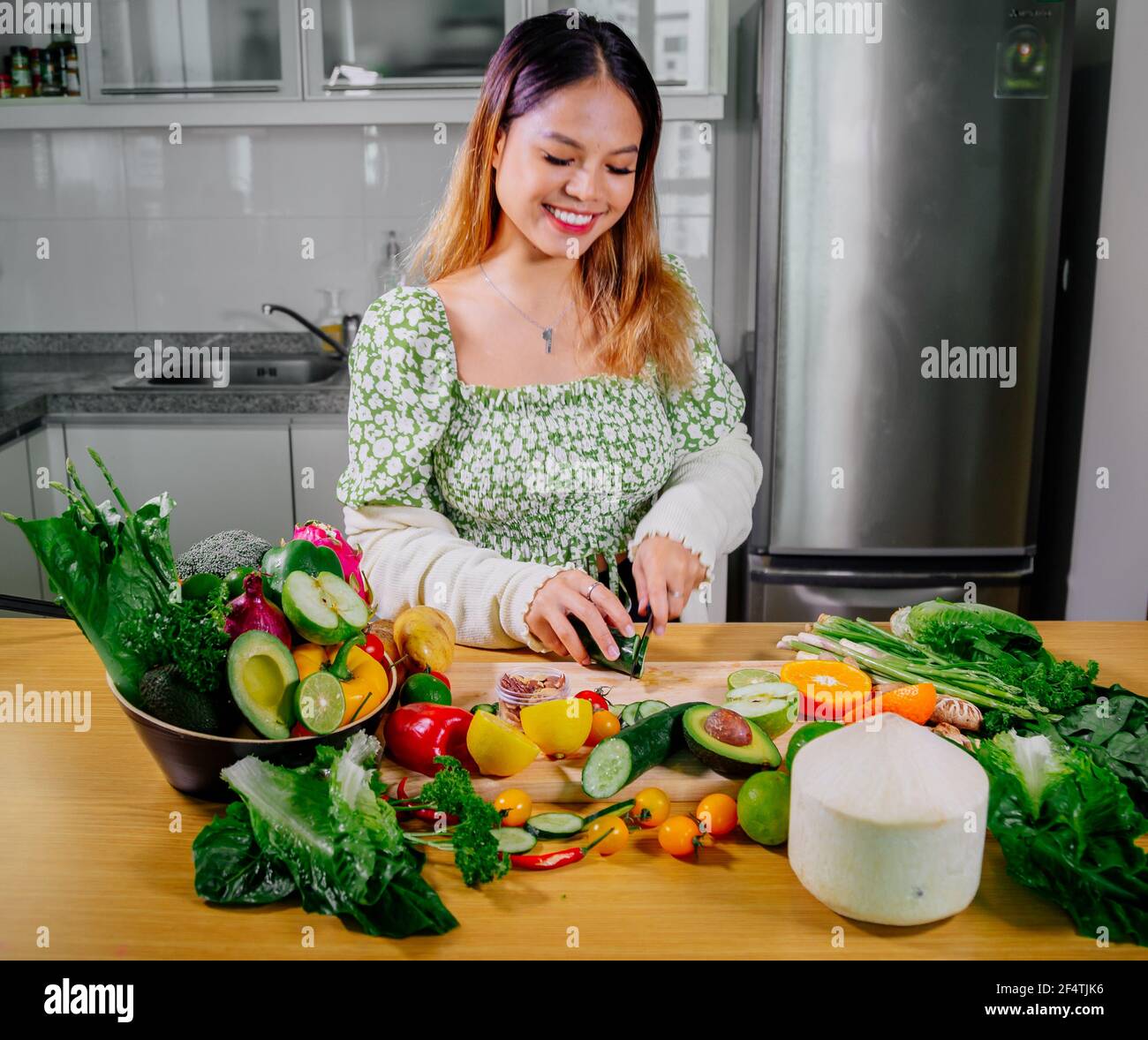 Asian girl cooking healthy vegetarian and vegan food, vegetables and ...