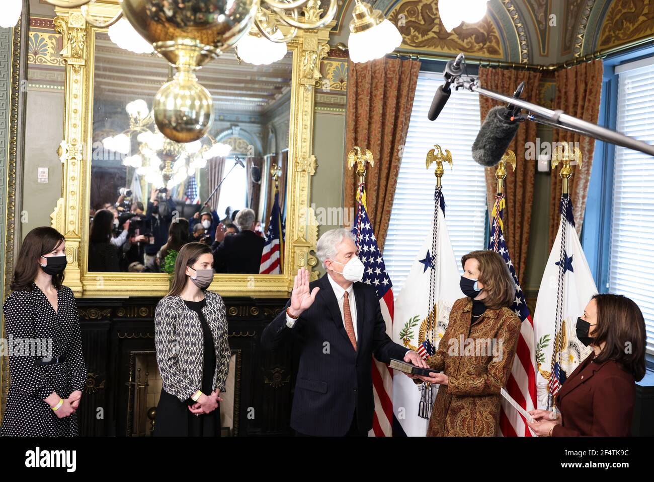 Vice President Kamala Harris, right swears-in William J. Burns, center ...