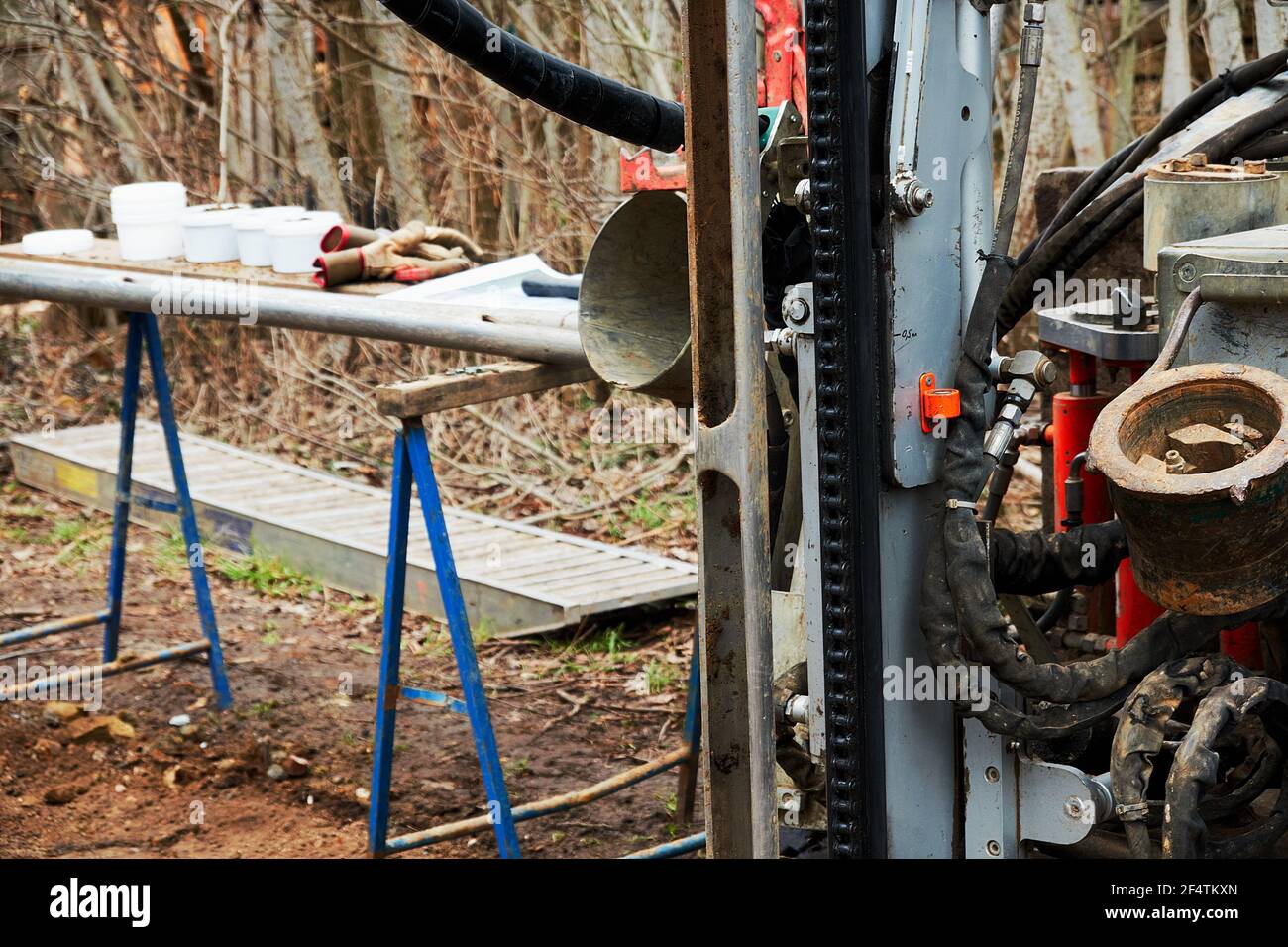 Drill rig and soil probe for taking soil samples in front of a field ...