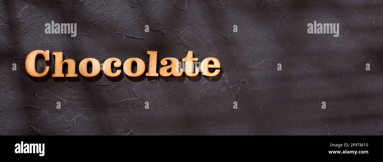 Chocolate word in wooden letters - Theobroma cacao Stock Photo - Alamy