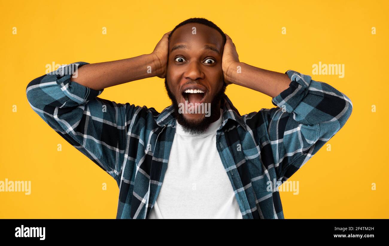 Shocked African American Man Shouting Omg Touching Head, Yellow ...