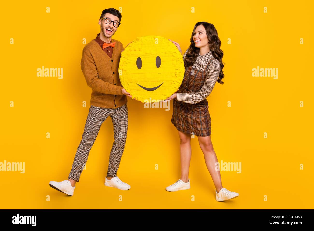 Full length body size view of attractive cheerful couple holding in ...