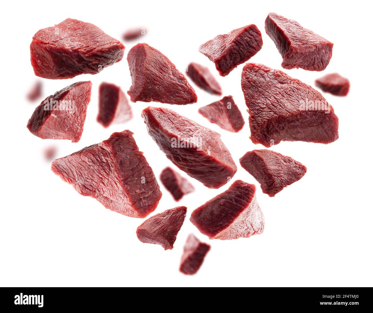 Pieces of fresh meat in the shape of a heart on a white background ...