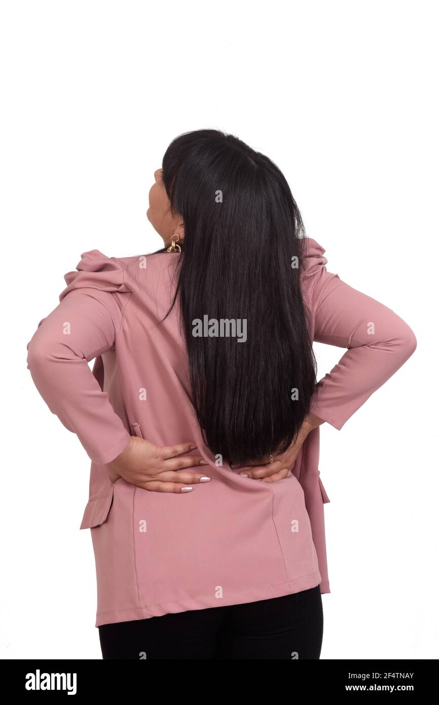 portrait of a woman from behind with pain in her back on white ...