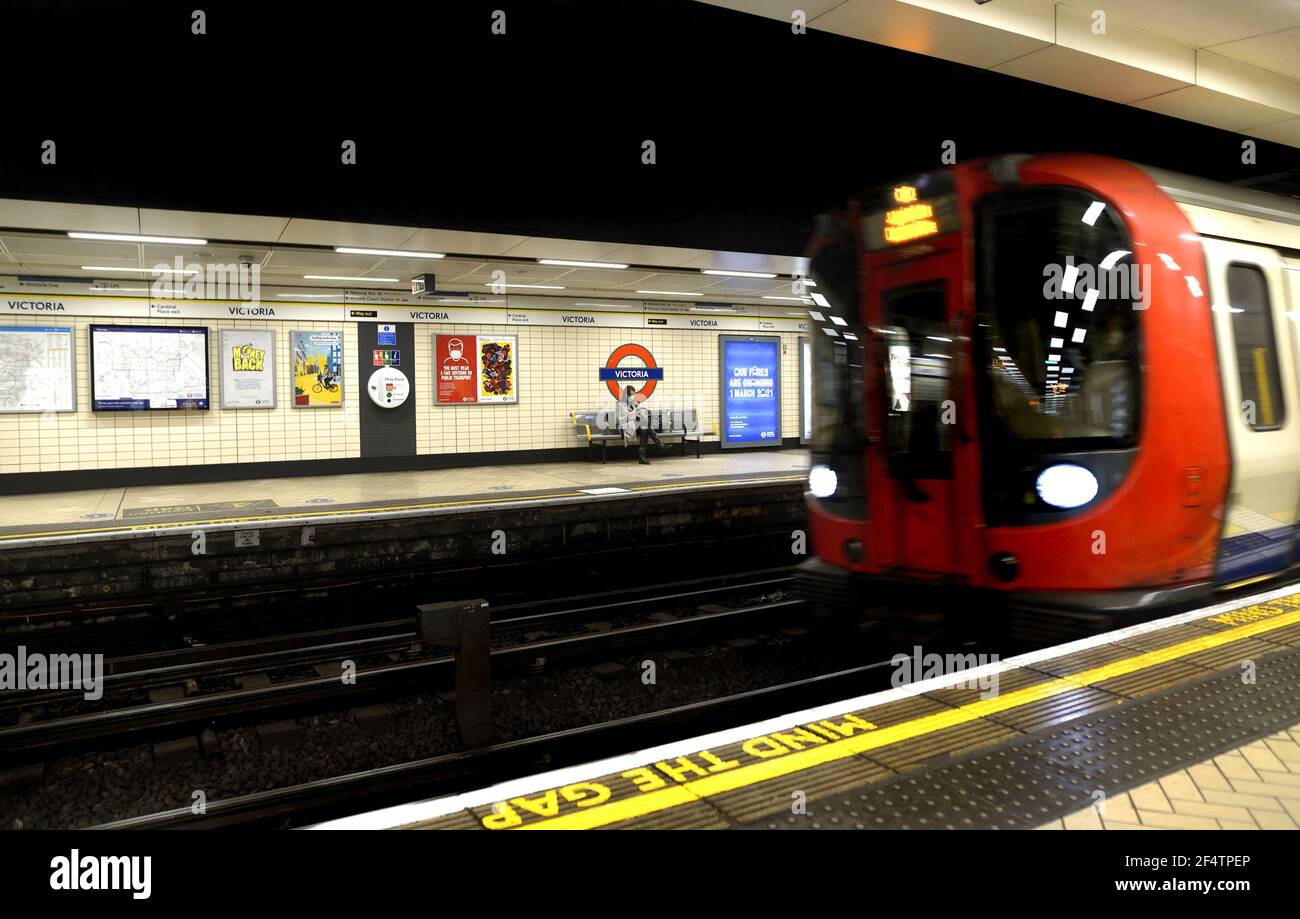London, England, UK. Tube train arriving at a platform of Victoria ...
