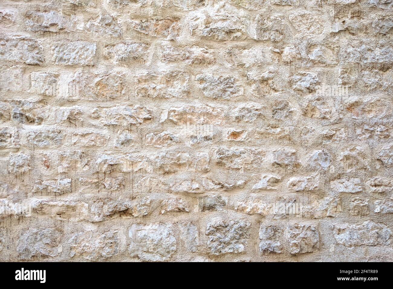 Light colour stone wall background texture Stock Photo - Alamy