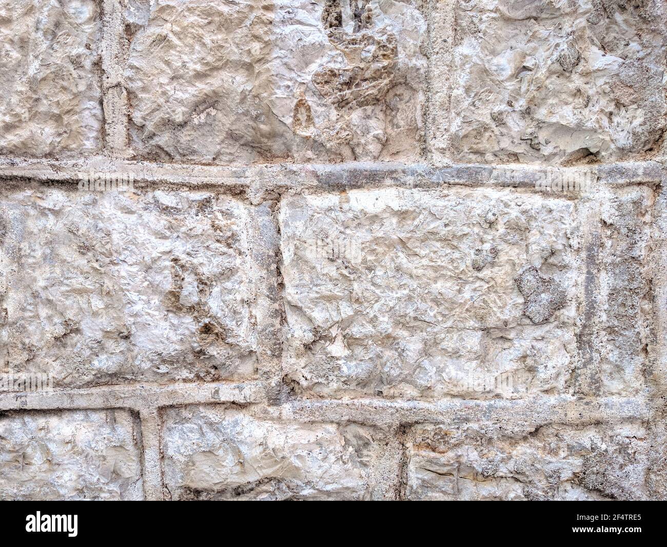 Old beige stone wall background texture Stock Photo - Alamy