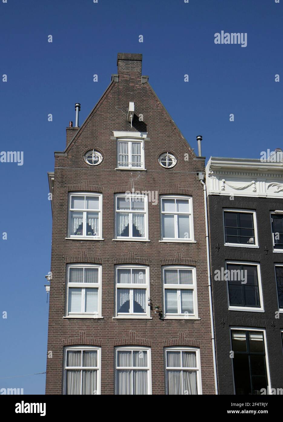 Traditional Dutch House with lifting hook in Amsterdam, Netherlands ...
