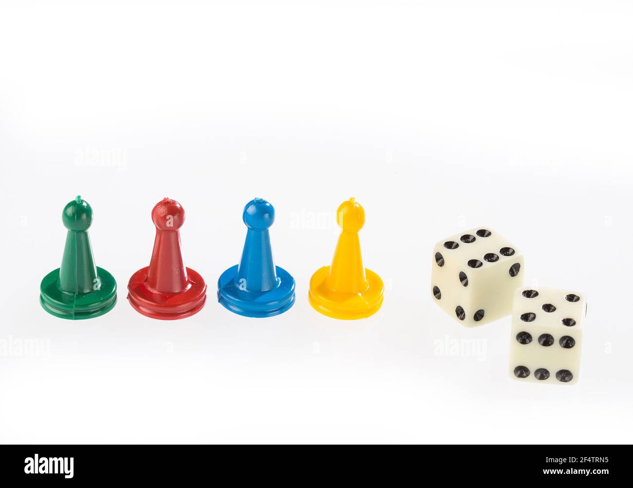 Colorful game pieces and dice Stock Photo - Alamy