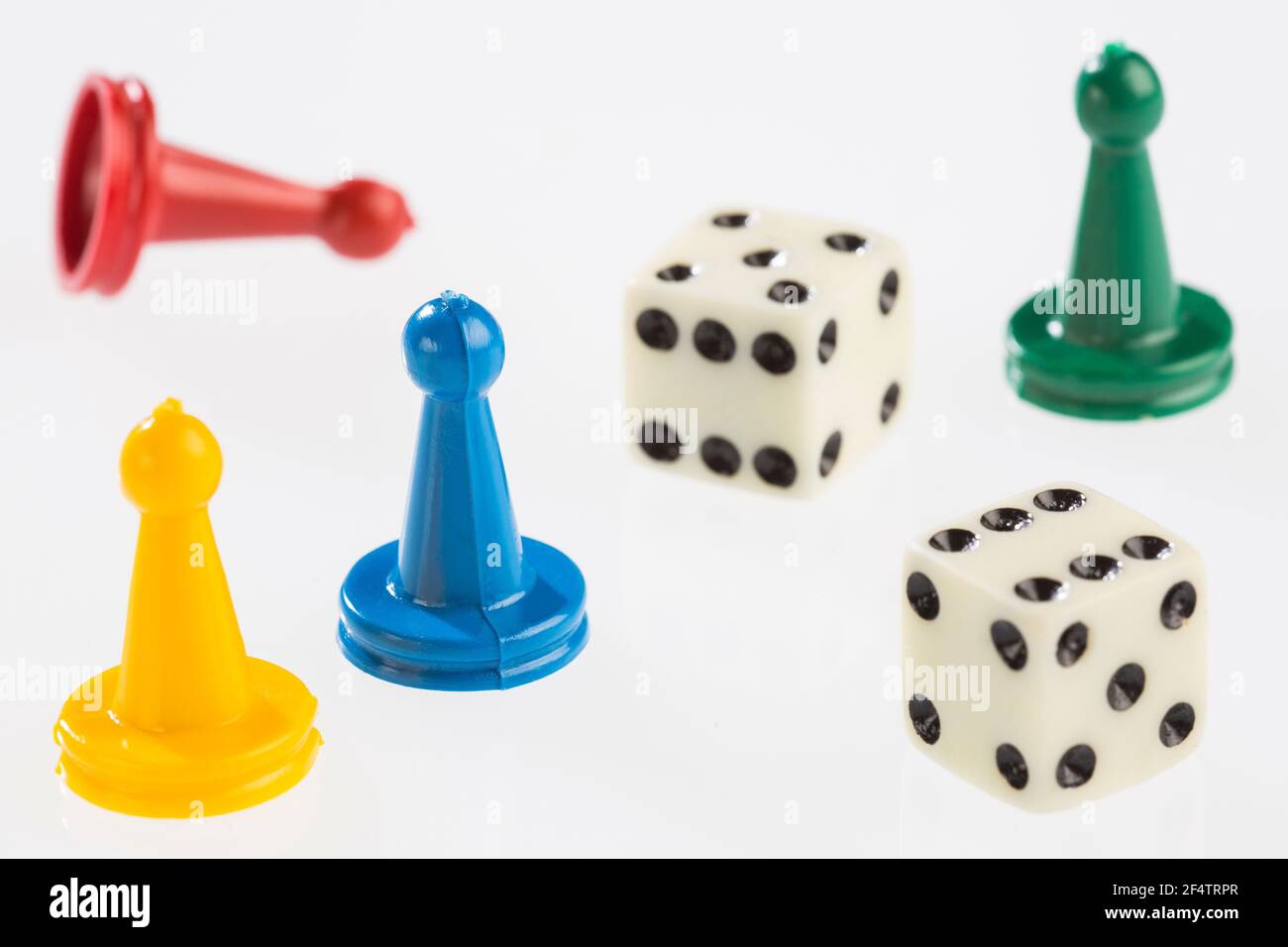 Colorful game pieces and dice Stock Photo - Alamy