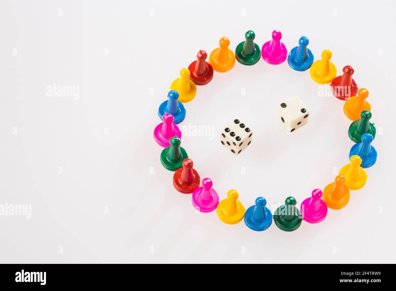 Colorful game pieces and dice Stock Photo - Alamy