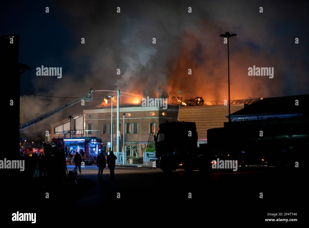 House burning at night with firefighters and smoke Stock Photo - Alamy
