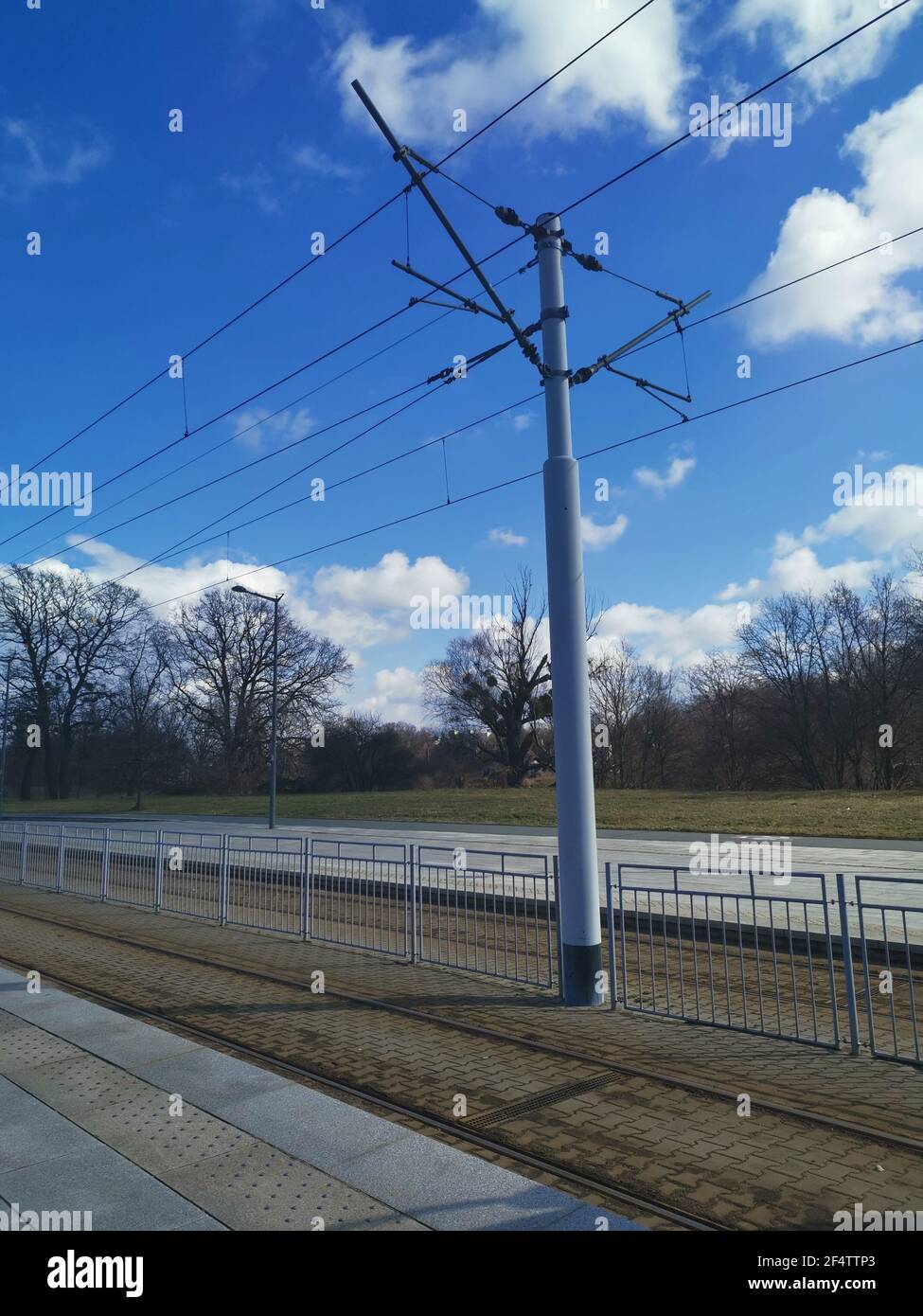 Closeup shot of an electric transformer near the highway on the blue ...