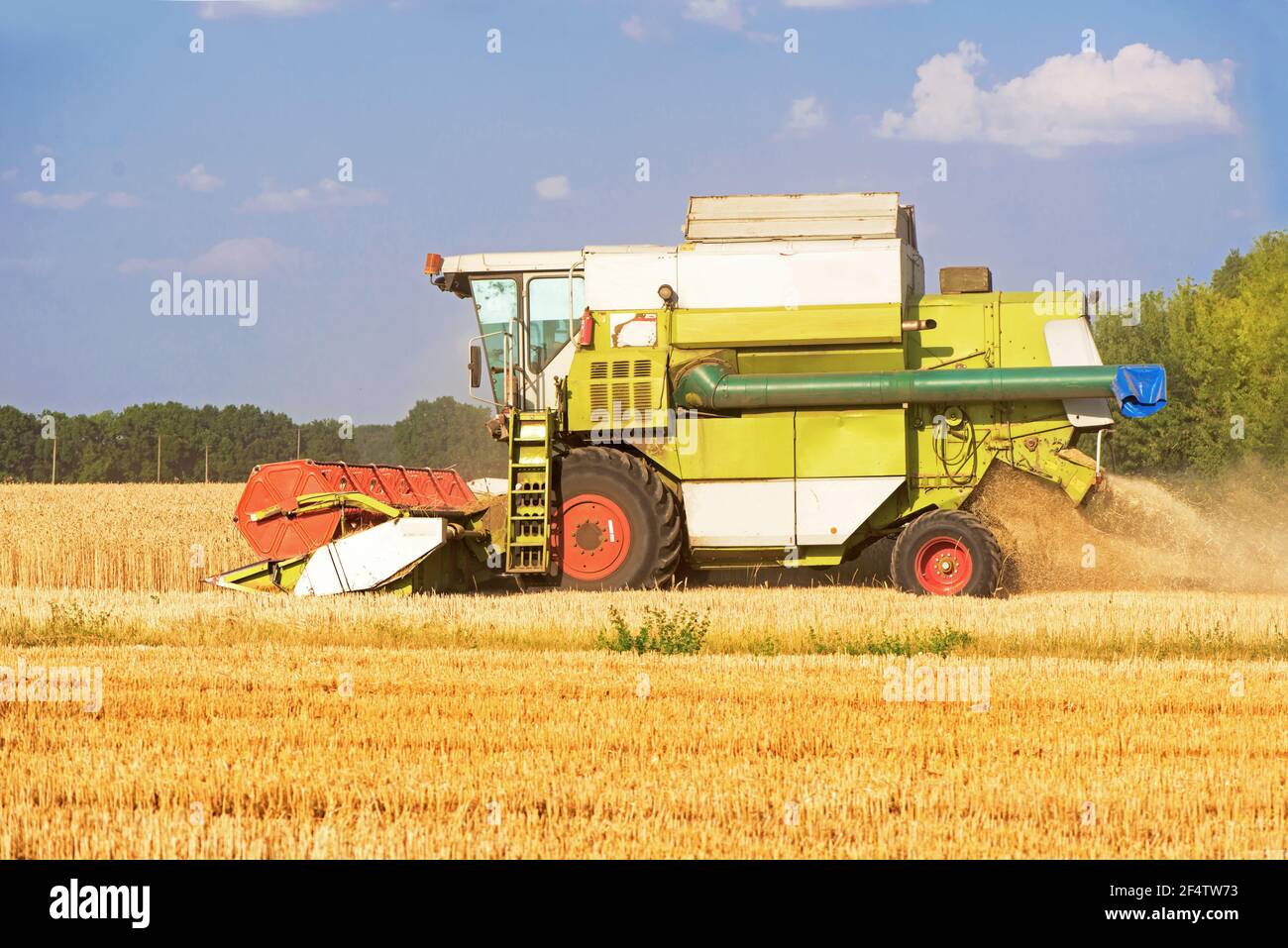 Harvester machine to harvest wheat field working. Combine harvester ...