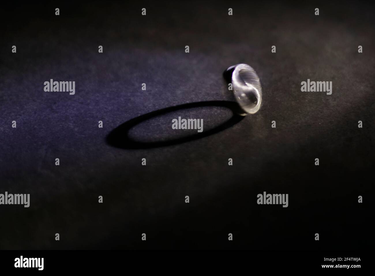 Moving of an engagement ring with his shadow Stock Photo - Alamy