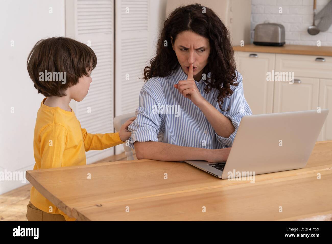 Angry mom on laptop hi-res stock photography and images - Alamy