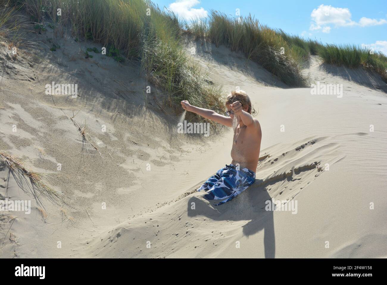 Boy in the dunes hi-res stock photography and images - Alamy