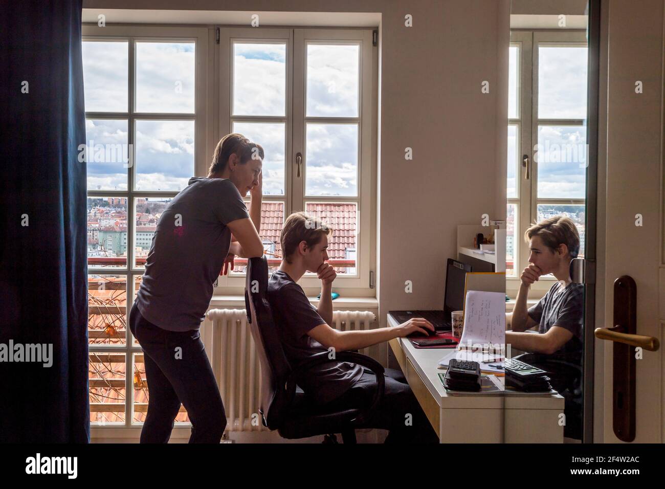 Teenager doing homework sitting hi-res stock photography and images - Alamy