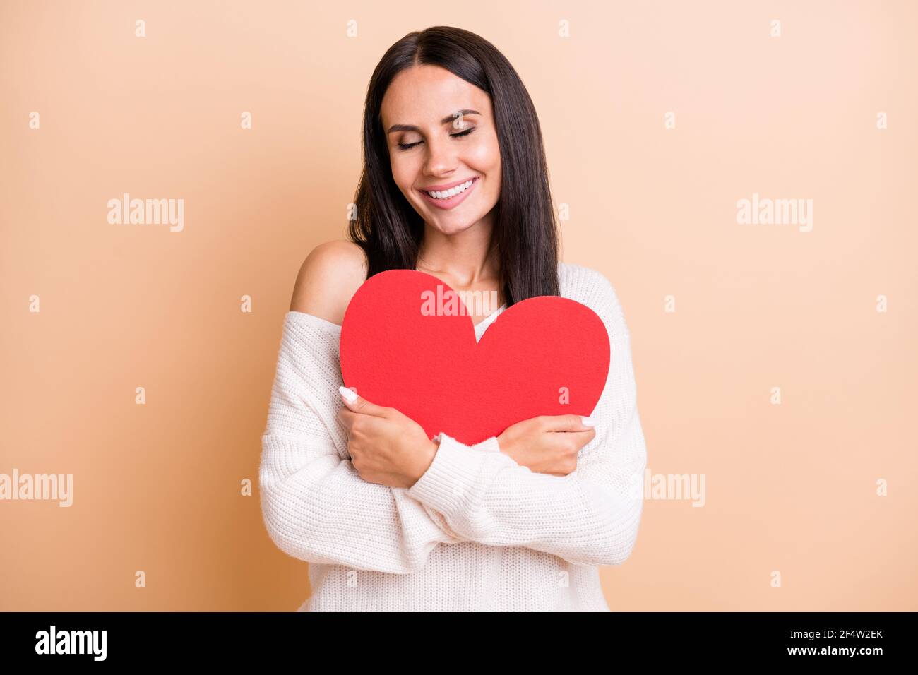 Photo of young girl happy smile dream dreamy hug big red heart cozy ...