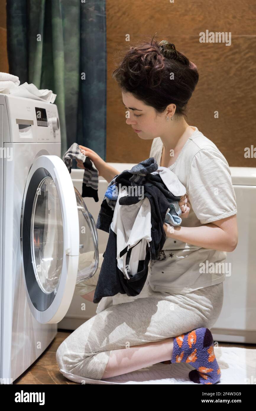 Woman putting out washing hi-res stock photography and images - Alamy
