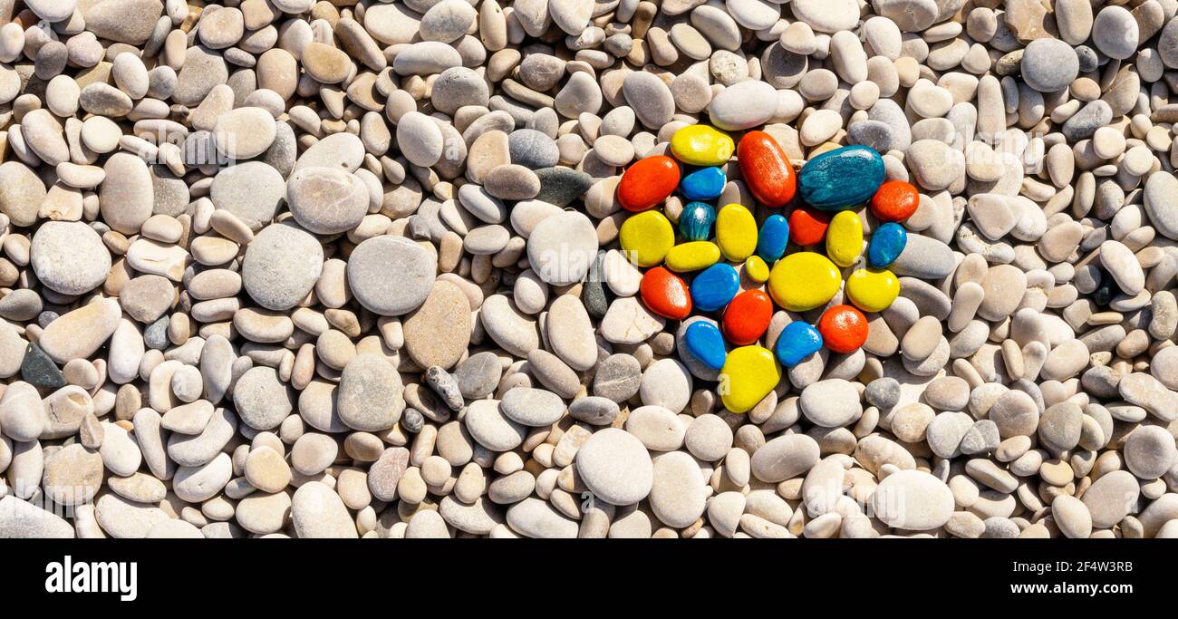 World autism awareness day. Top view to white beach stones with ...