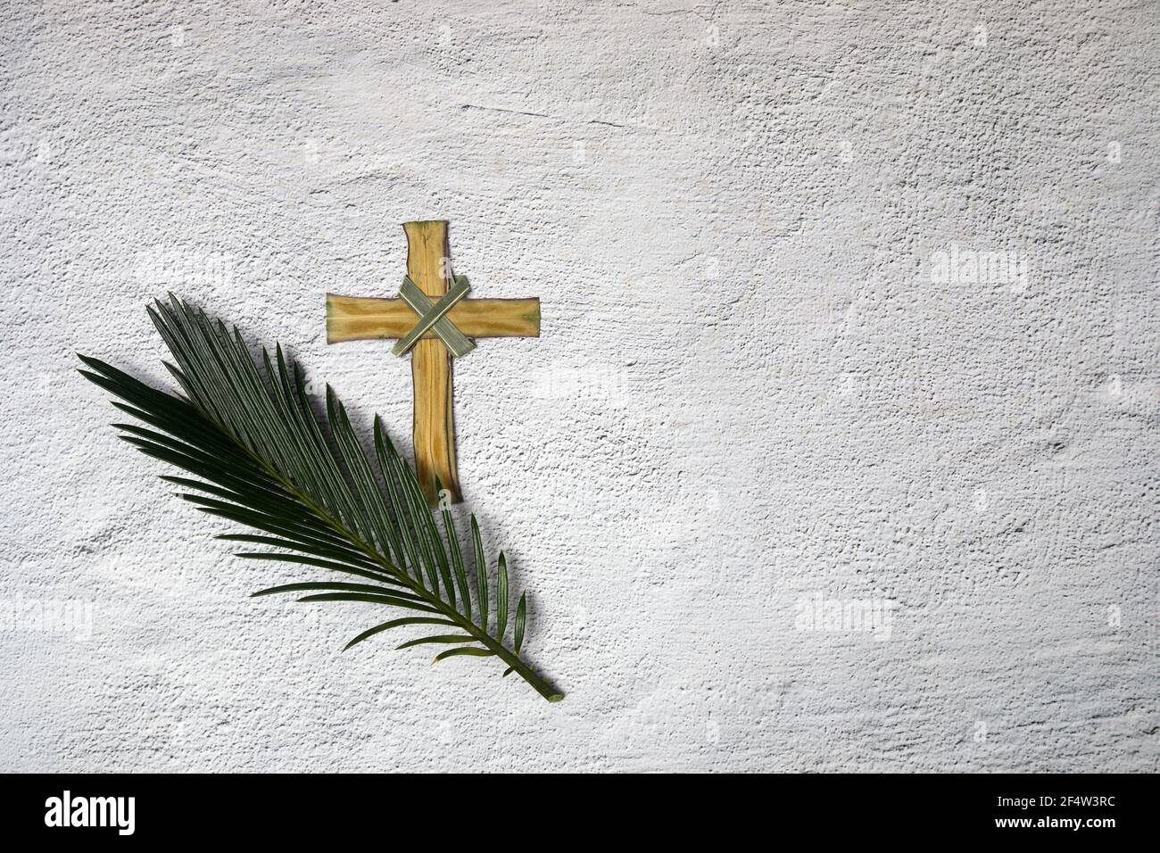Palm sunday background. Cross and palm on grey background Stock Photo ...