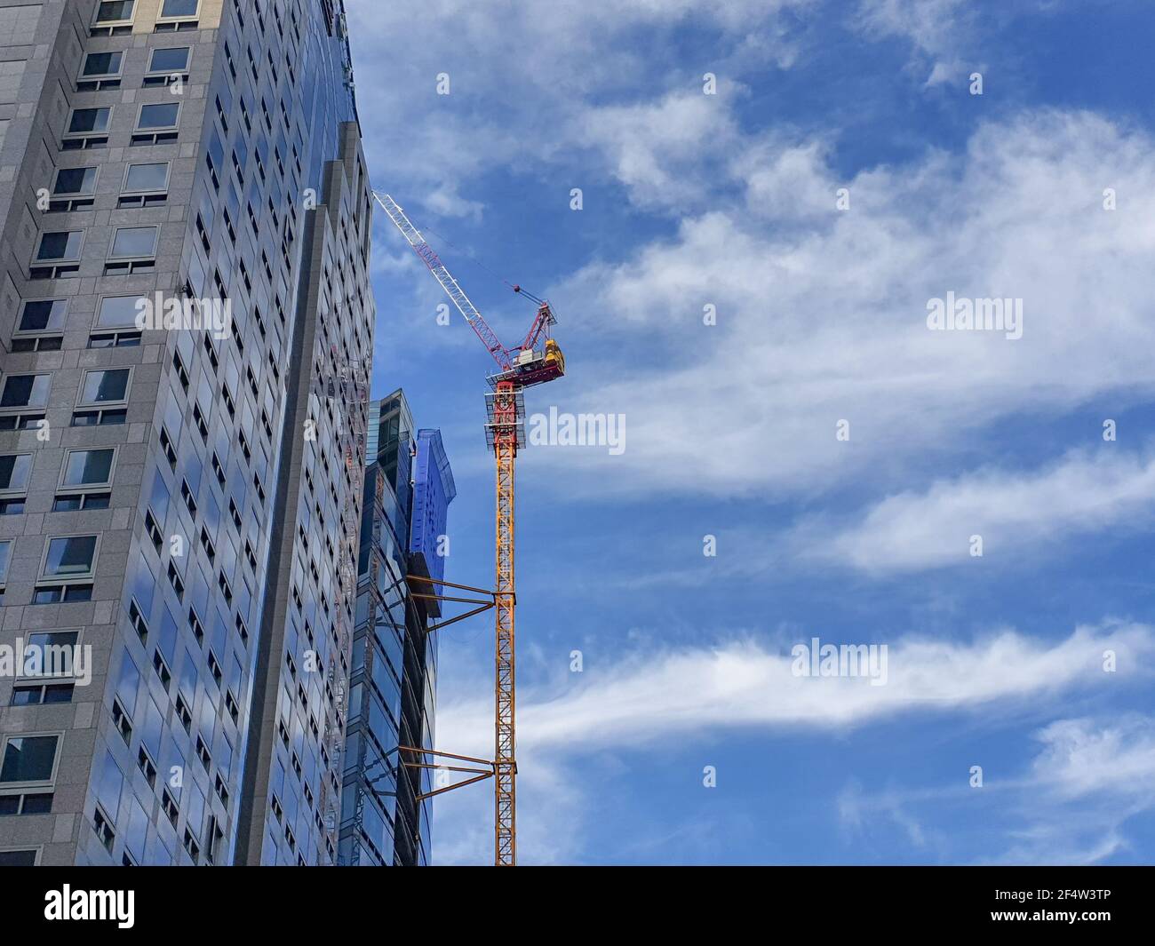 Tower Cranes in High-Rise Building Stock Photo - Alamy
