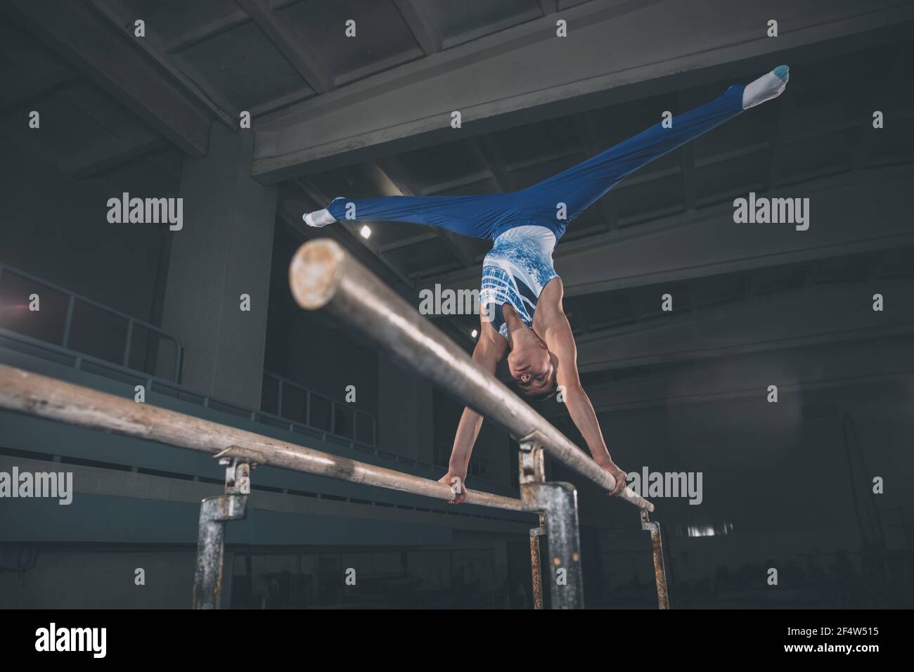 Little male gymnast training in gym, flexible and active. Caucasian fit ...