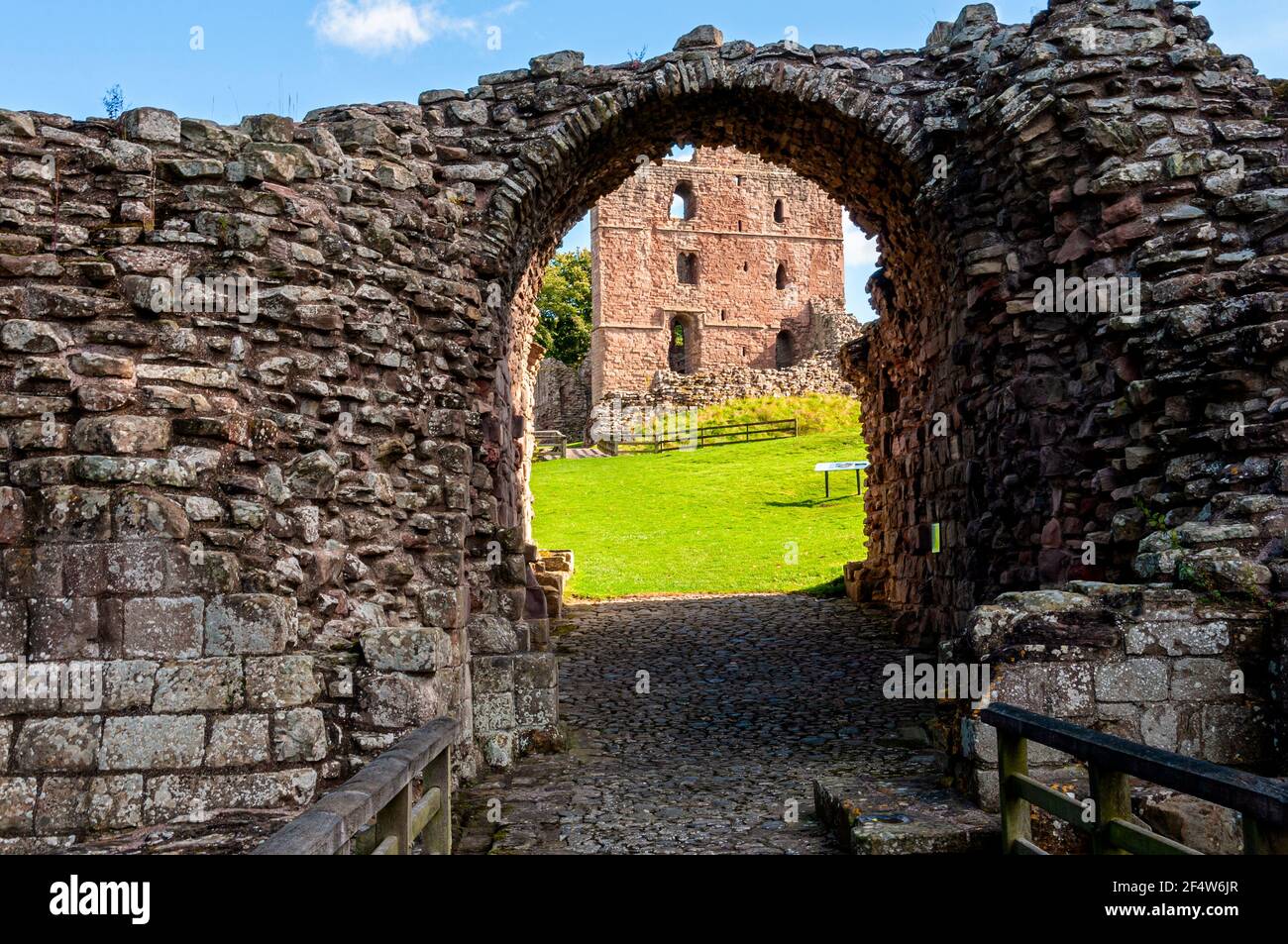 The ruins of a stone gateway in the curtain walls of Norham Castle ...