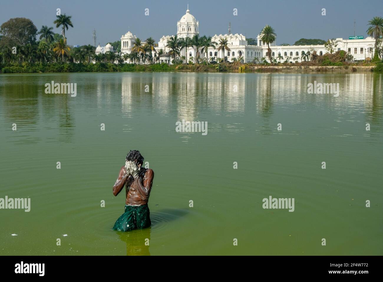 Agartala, India - December 2020: A man bathing in the Rajbari Lake of ...