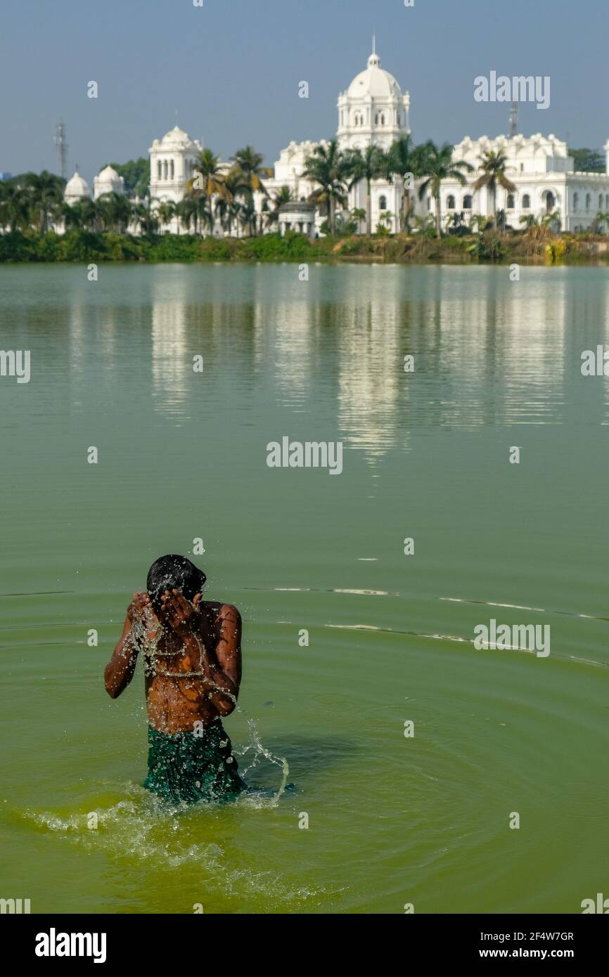 Agartala, India - December 2020: A man bathing in the Rajbari Lake of ...