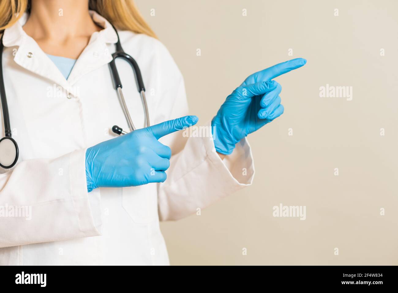 Image of female doctor pointing Stock Photo - Alamy