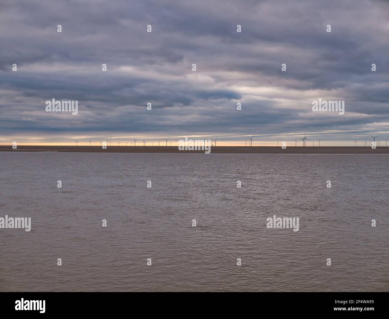 Offshore wind turbines off Wirral in the Mersey Estuary in the north ...