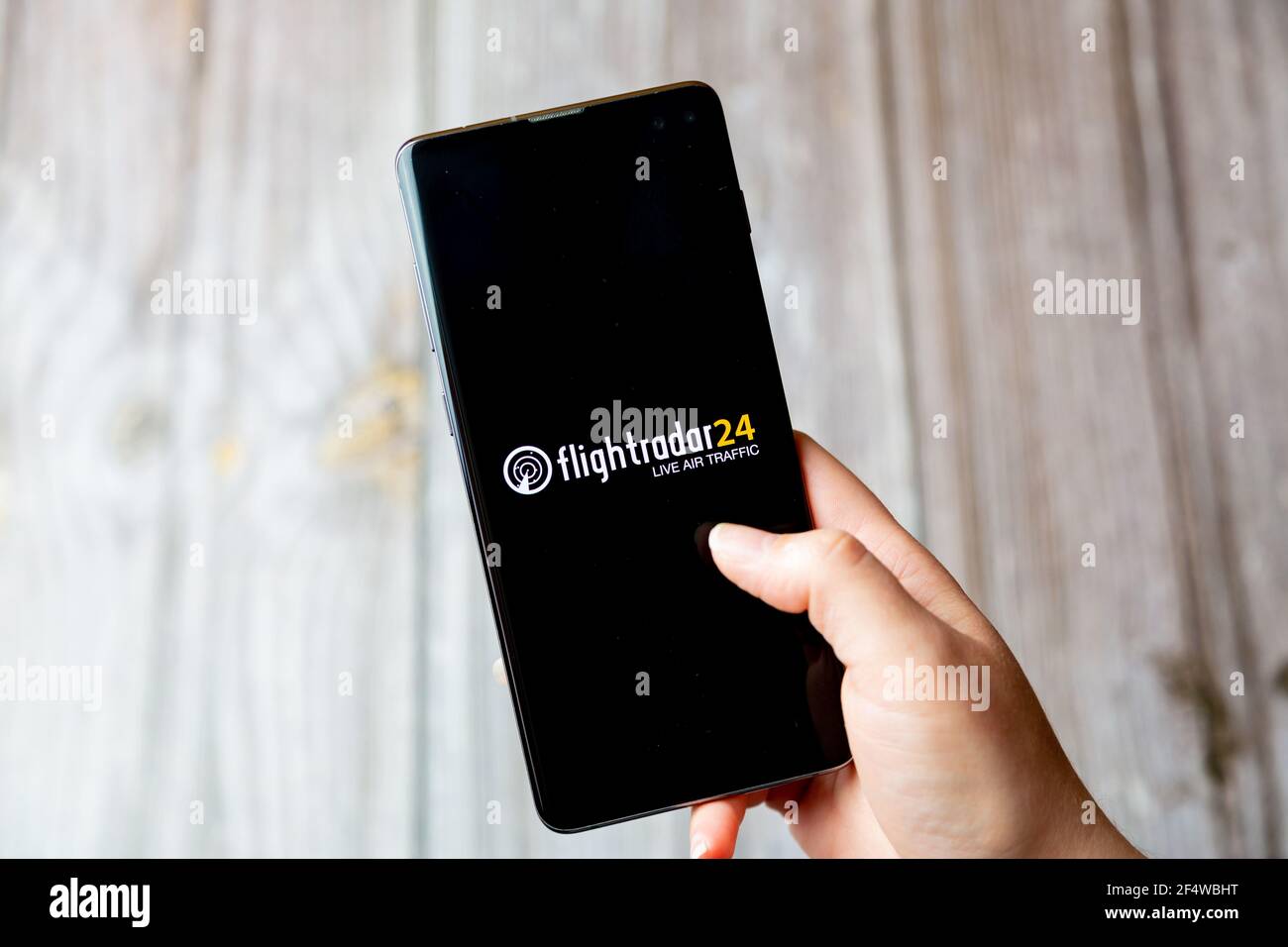 A mobile phone or cell phone being held in a hand with the ...