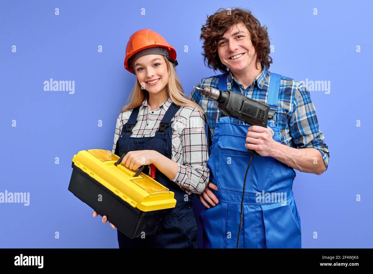 team of affable constructors with instruments tools posing isolated on ...