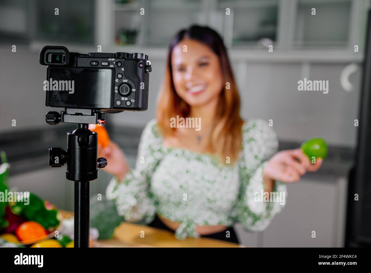 Asian woman blogger or content creator cooking and recording video ...