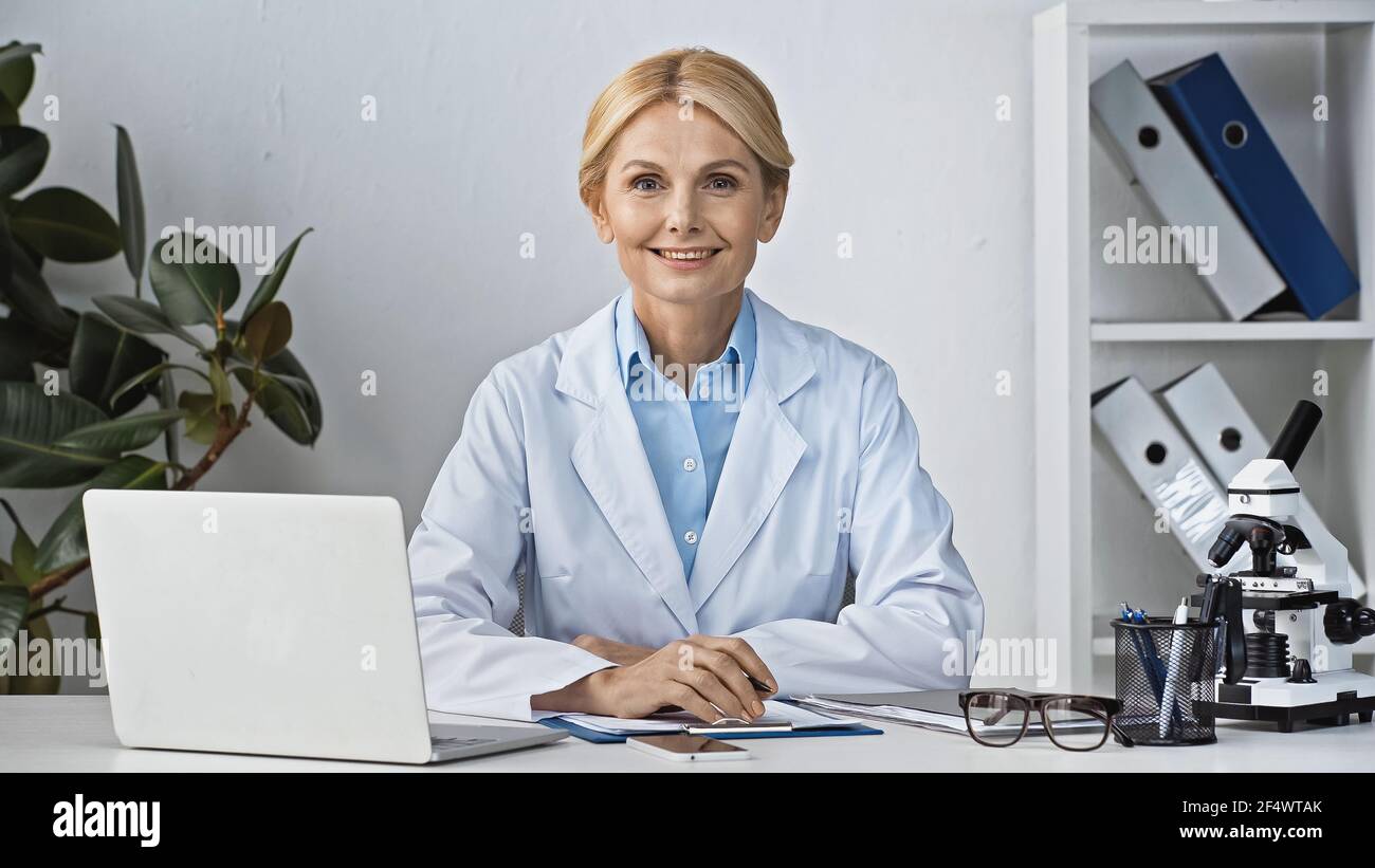 Microscope white coat smiling medical technology computer screen hi-res ...
